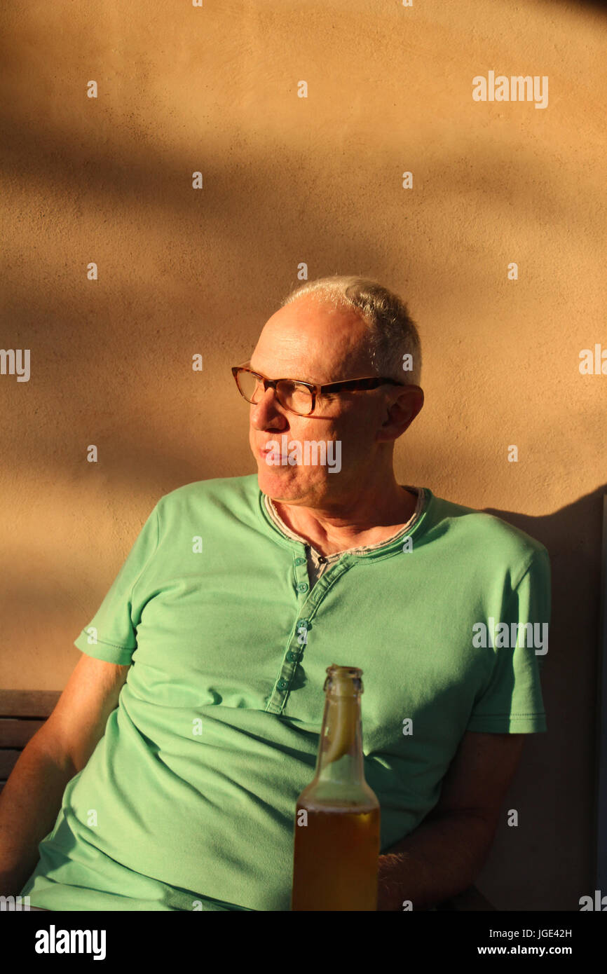 Mature man relaxing - Summer vacation - Sunset Stock Photo - Alamy