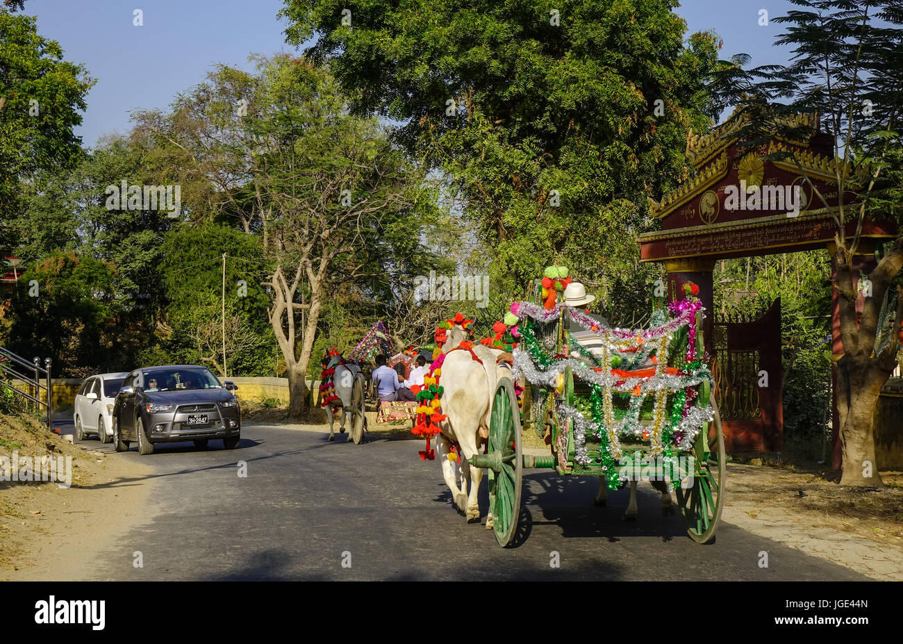 Mandalay, Myanmar - Feb 10, 2017. People and ox carts in Procession ...