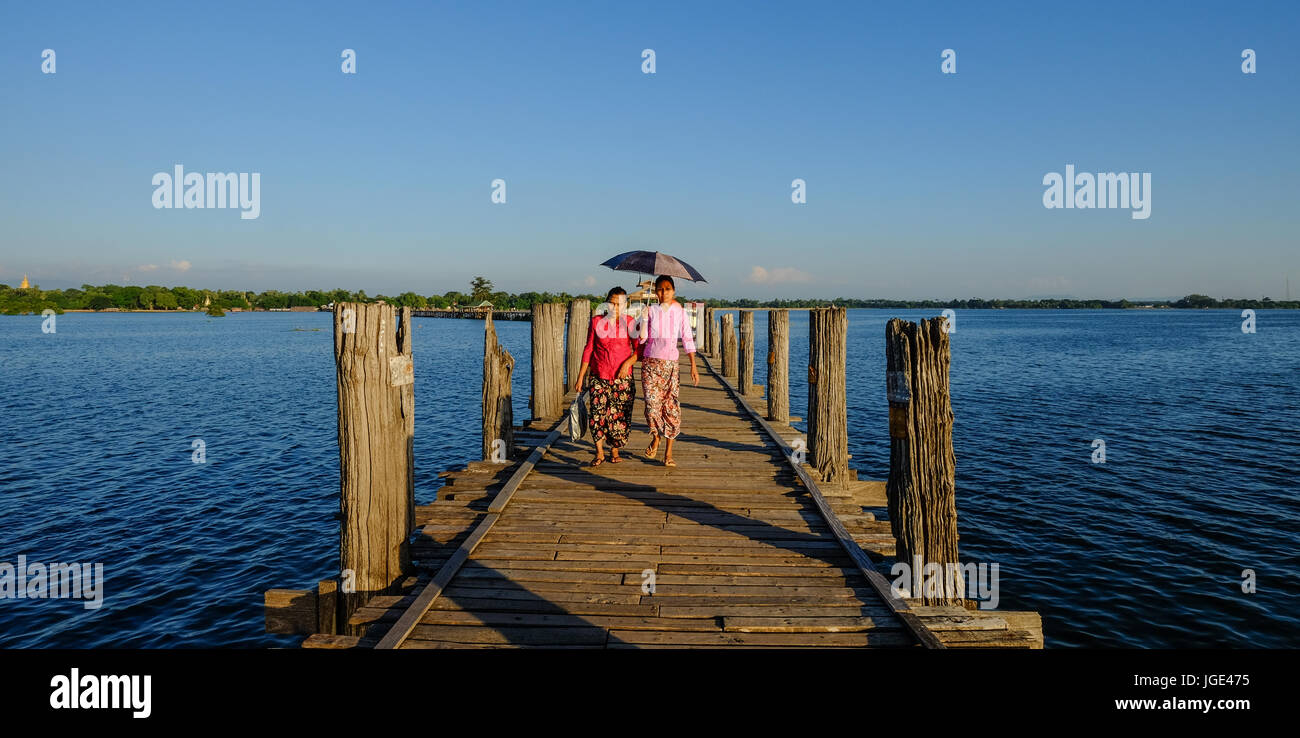 Mandalay, Myanmar - Oct 18, 2015. Burmese women on Ubein Bridge in ...