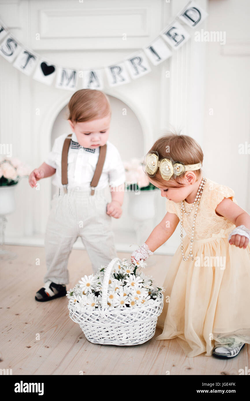 two babies - boy and girl dressed as bride and groom Stock Photo - Alamy