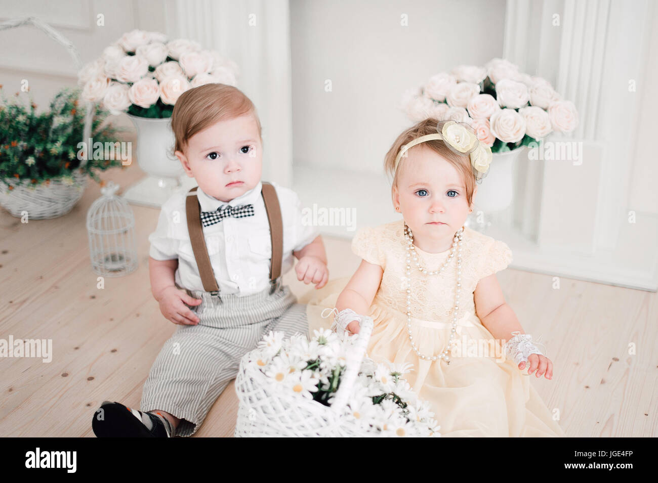 two babies - boy and girl dressed as bride and groom Stock Photo - Alamy