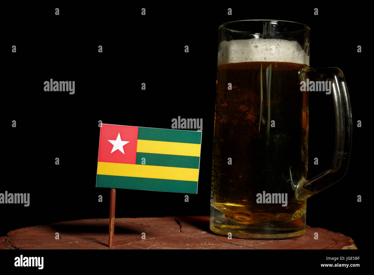 Togo flag with beer mug isolated on black background Stock Photo - Alamy