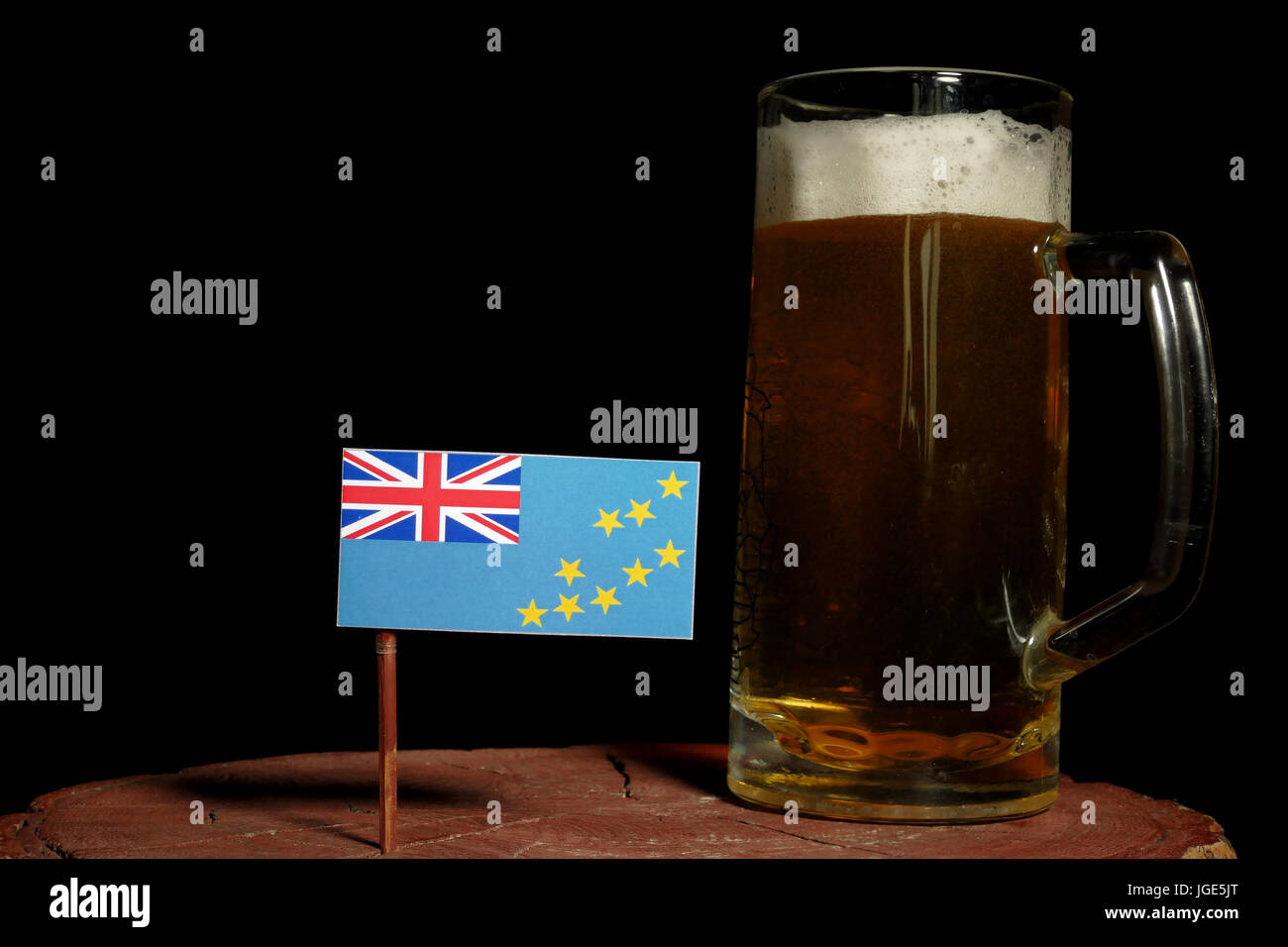 Tuvalu flag with beer mug isolated on black background Stock Photo - Alamy