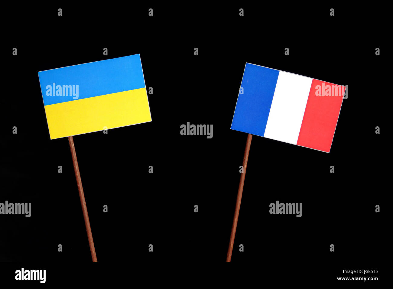 Ukraine flag with French flag isolated on black background Stock Photo ...