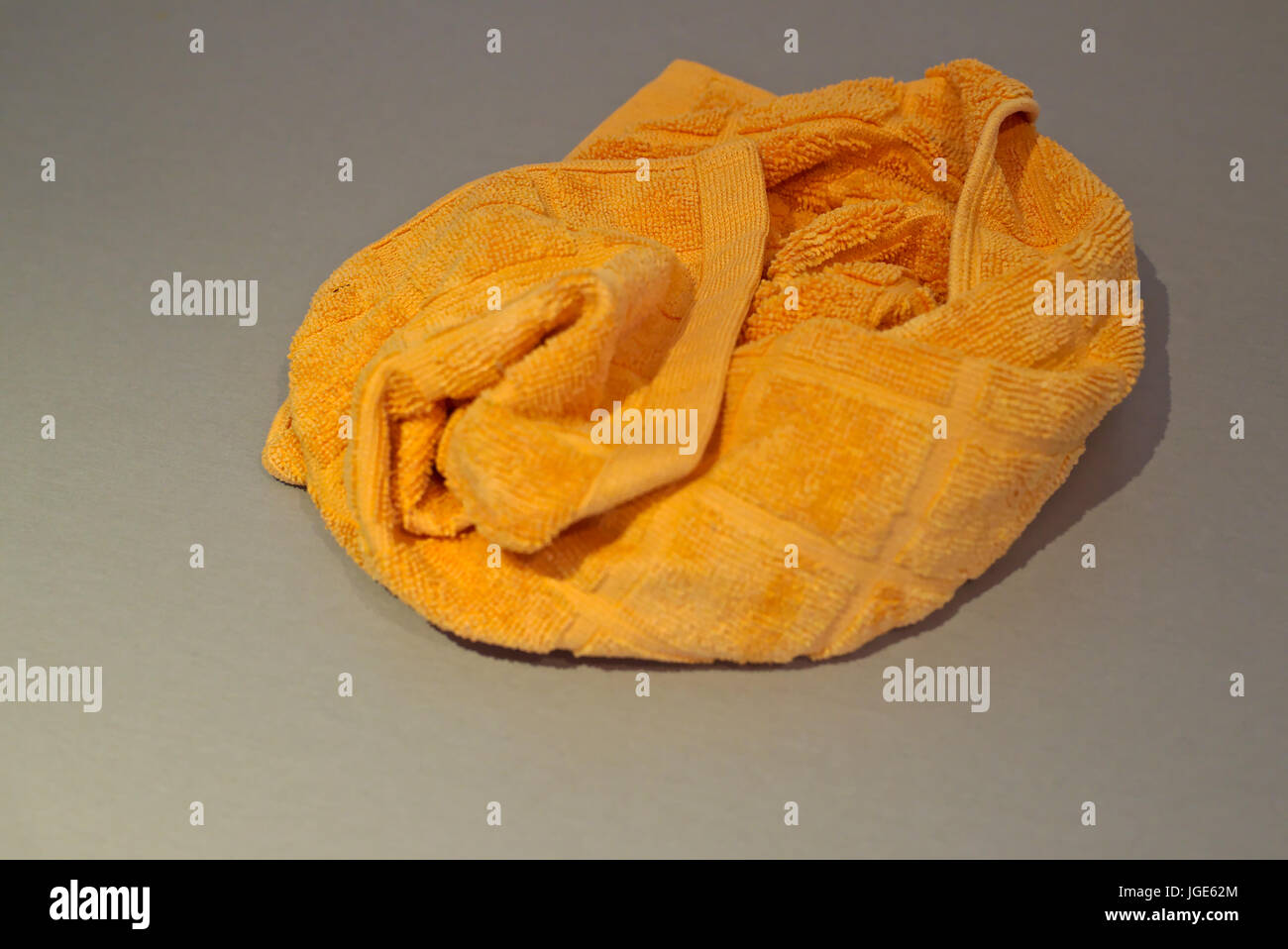 Simple orange kitchen rag Stock Photo - Alamy