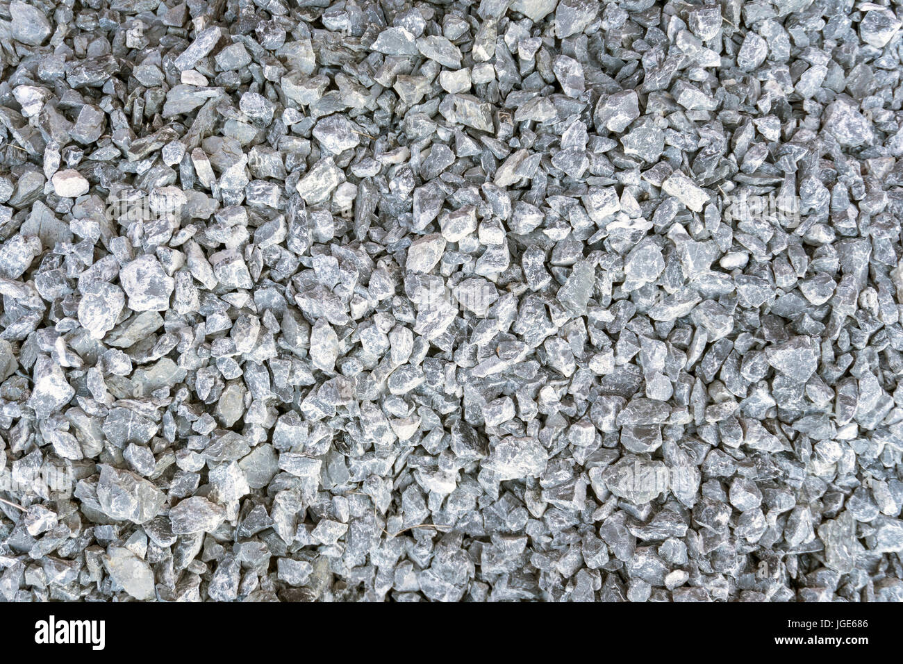 Small grey stones background Stock Photo - Alamy