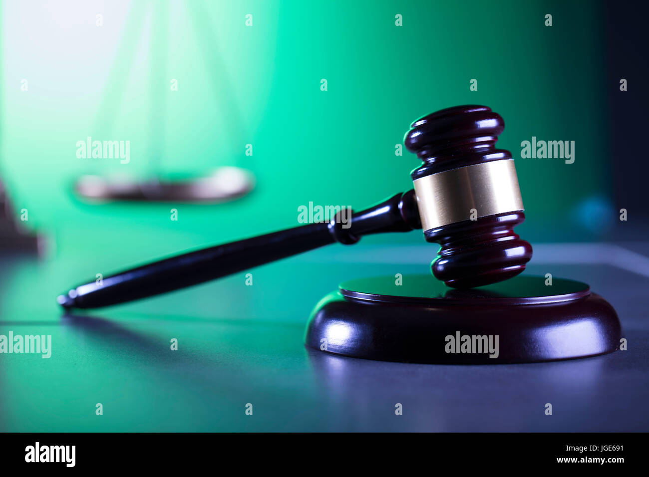Gavel and scale. Law and justice concept. Green background Stock Photo ...