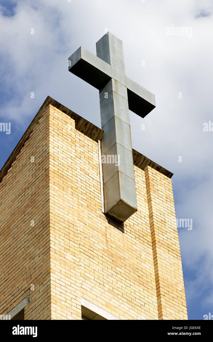 Cross Methodist Church on a background of blue sky with clouds on a ...