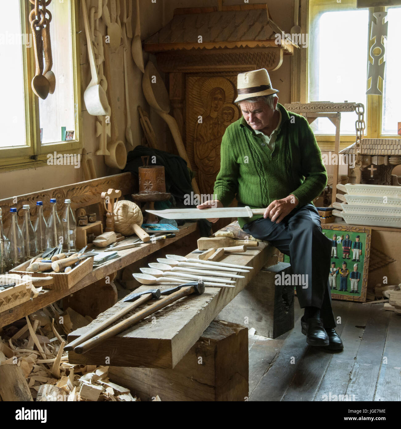 A wood worker in the laboratory for the production of traditional ...