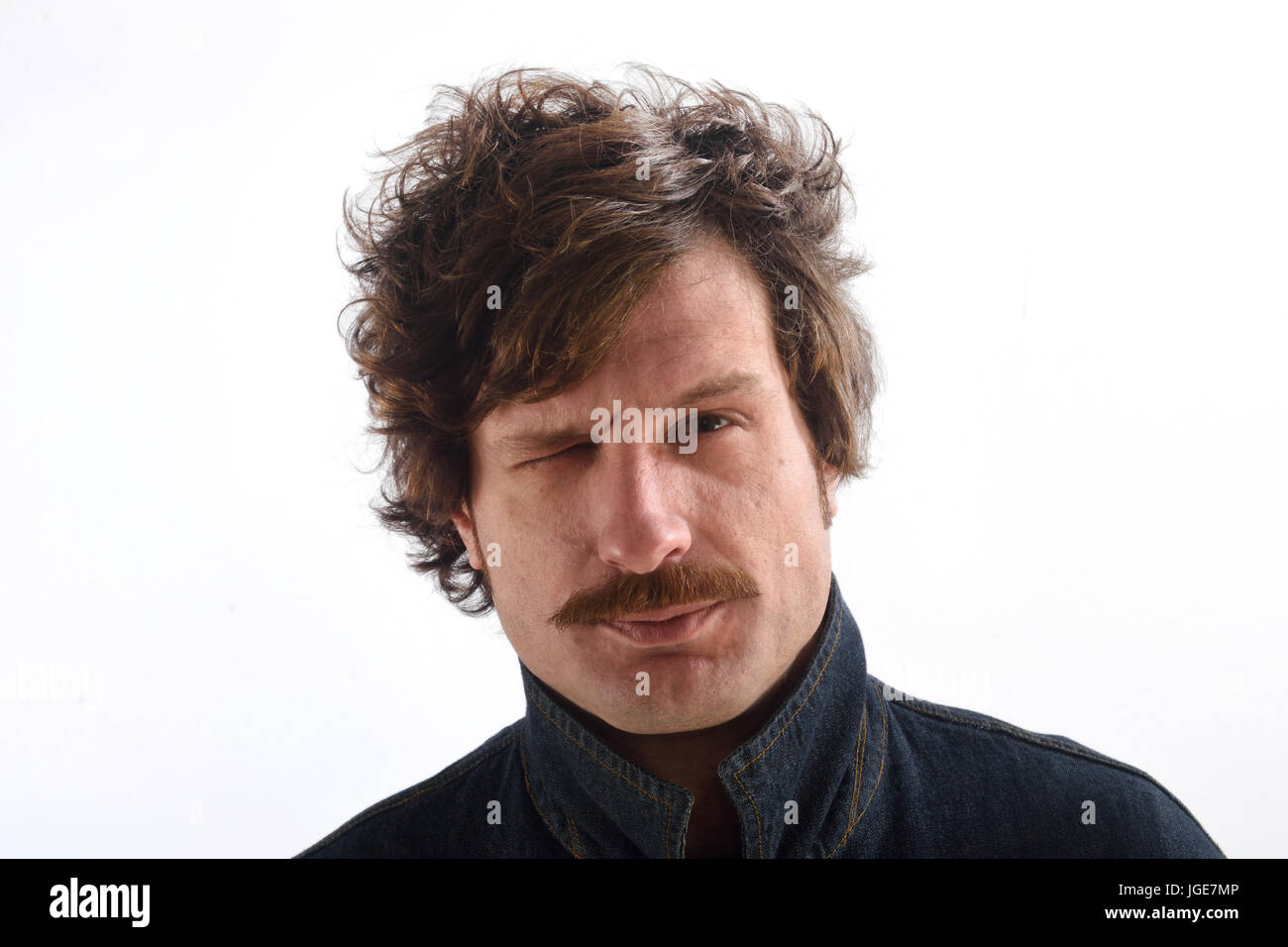 Portrait of a young man wink the eye on white background Stock Photo ...
