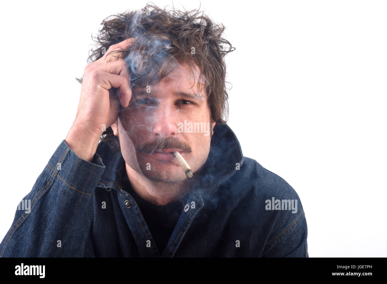 Portrait of a man smoking liar tobacco on white background Stock Photo ...