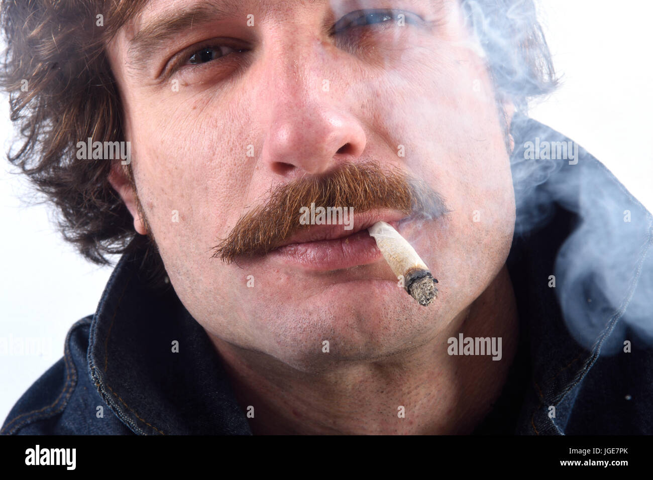 Portrait of a man smoking liar tobacco on white background Stock Photo ...