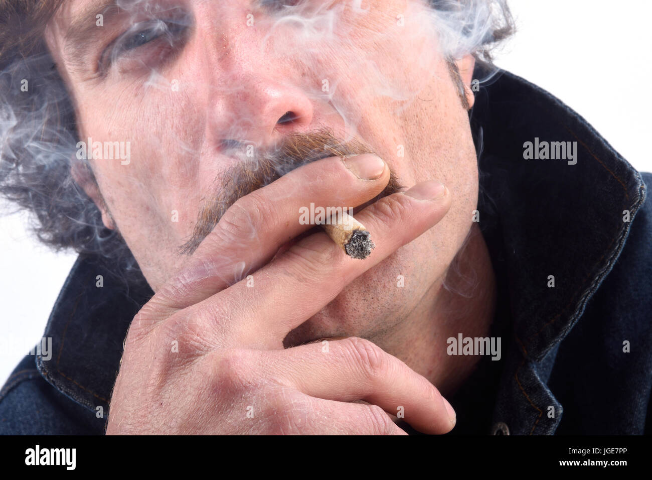 Portrait of a man smoking liar tobacco on white background Stock Photo ...