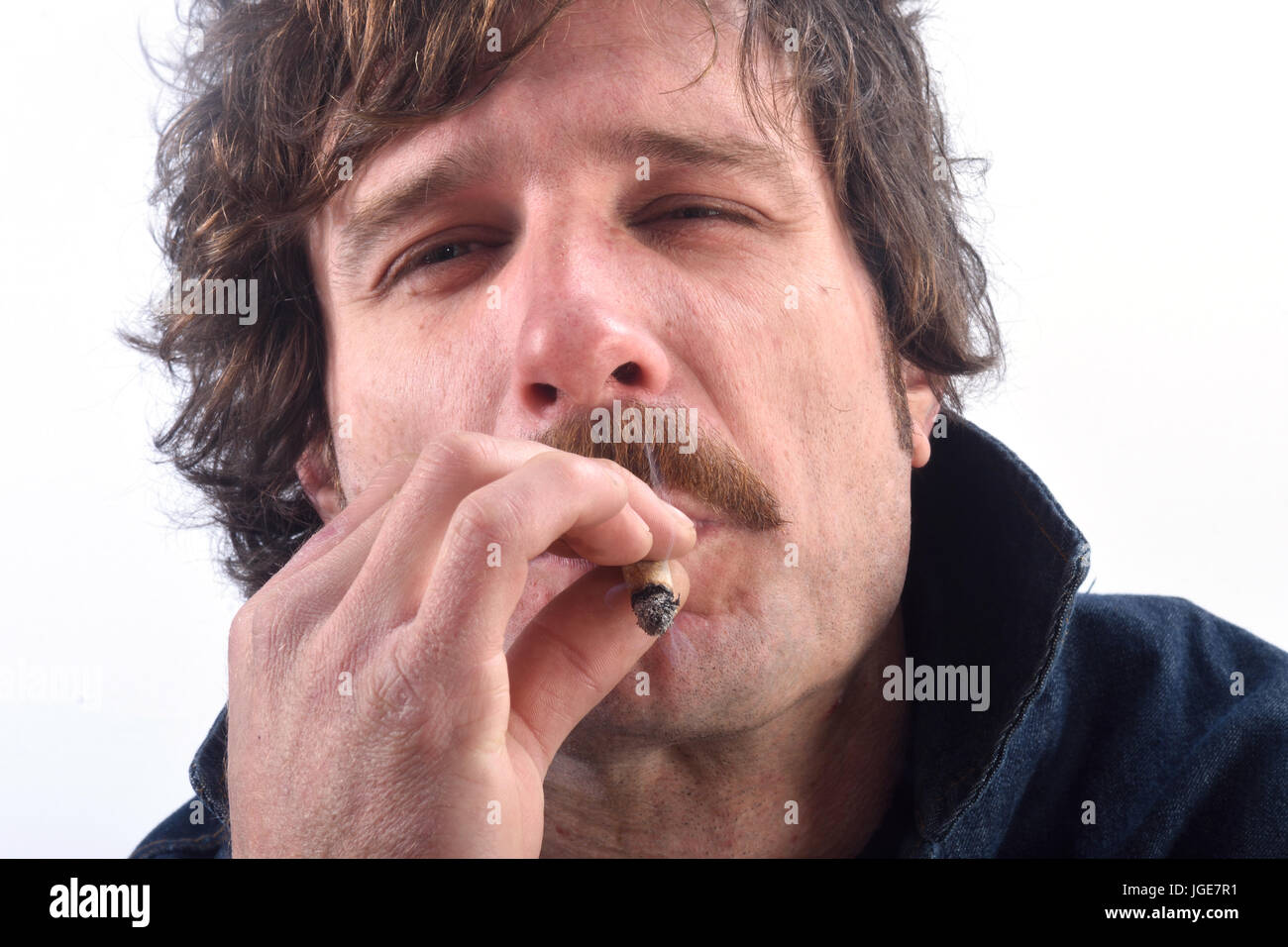 Portrait of a man smoking liar tobacco on white background Stock Photo ...