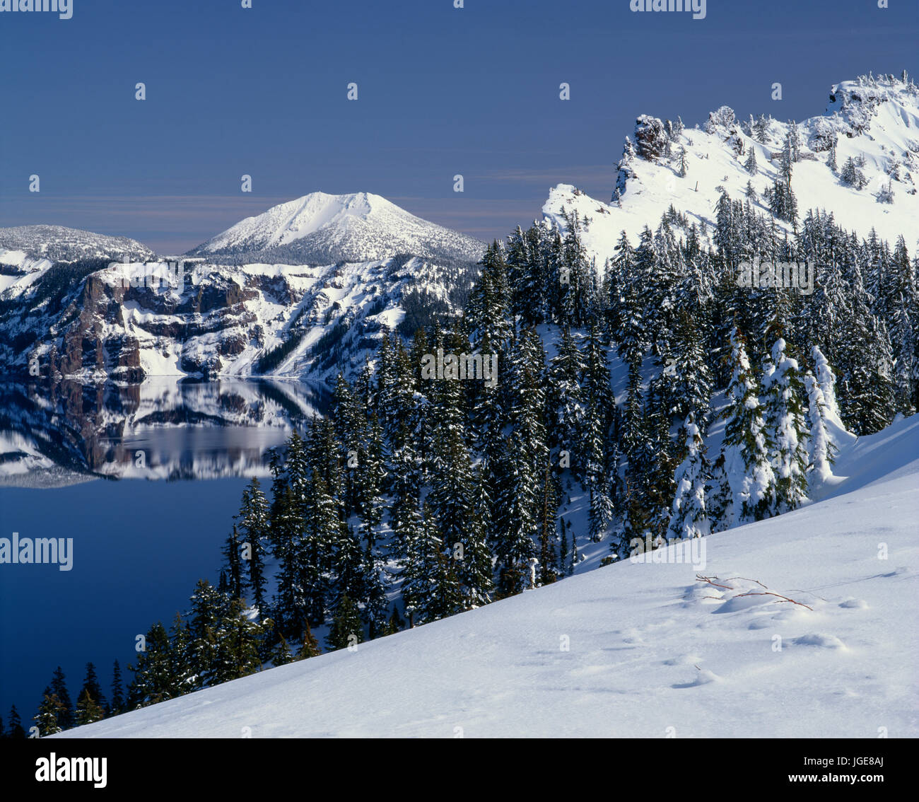 USA, Oregon, Crater Lake National Park, Winter snow accumulates at ...
