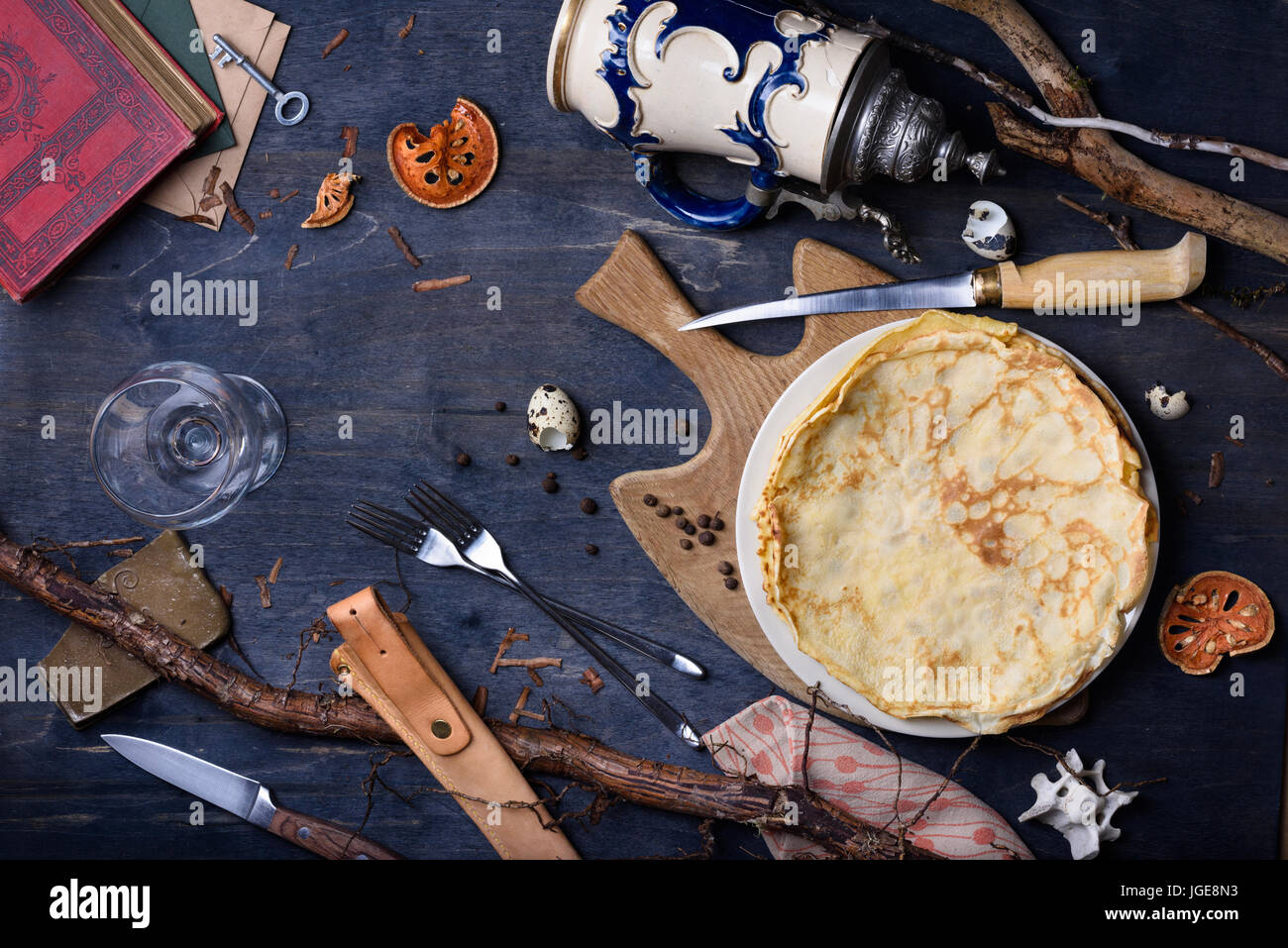 Rusty table with pancakes snack, hunters hut vintage style. Top view ...