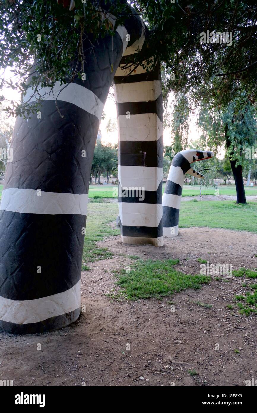Large black and white striped free-form concrete snake at Kit Carson ...