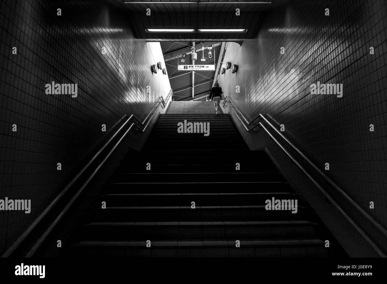 Japanese woman walking on staircase at Izumi-tamagawa station on the ...