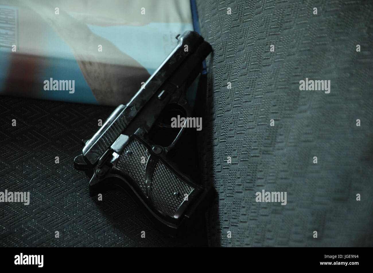 Male hand with revolver Stock Photo - Alamy