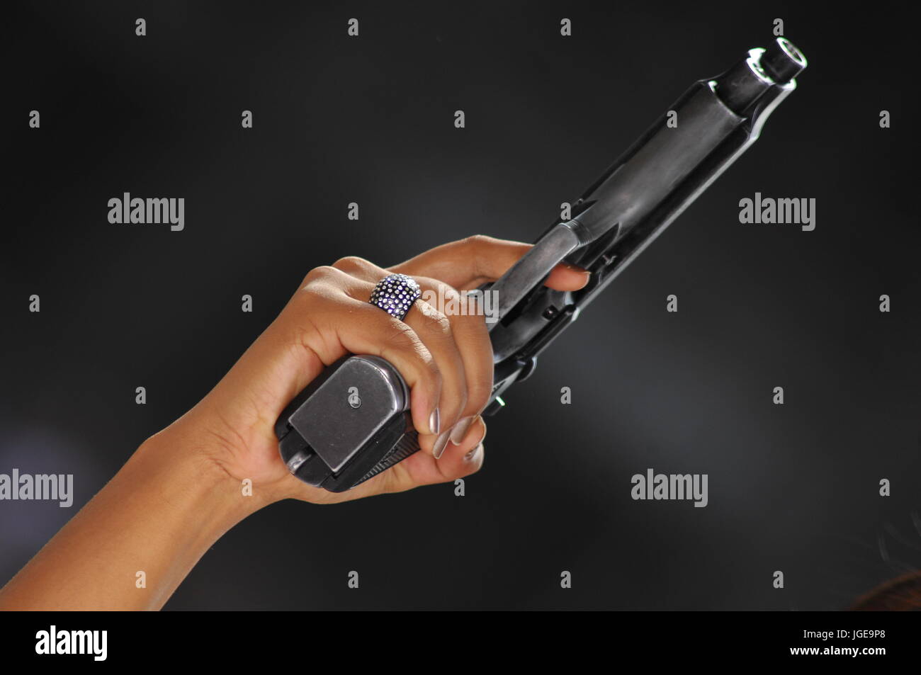 Male hand with revolver Stock Photo - Alamy