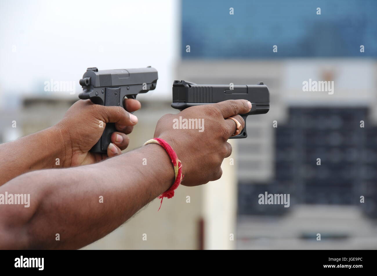 Male hand with revolver Stock Photo - Alamy