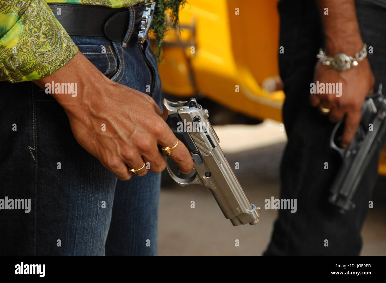 Male hand with revolver Stock Photo - Alamy