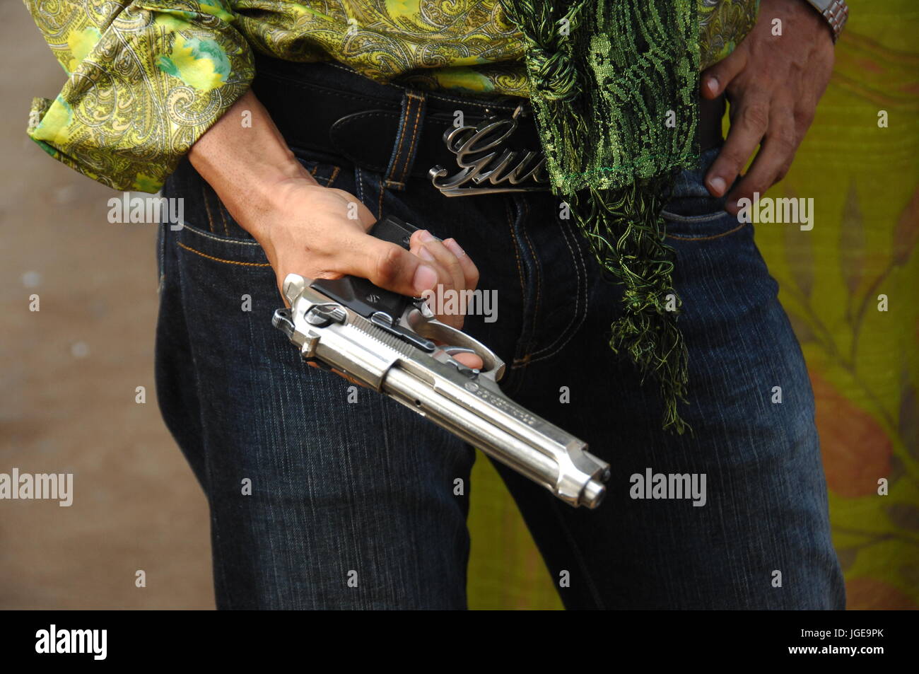 Male hand with revolver Stock Photo - Alamy