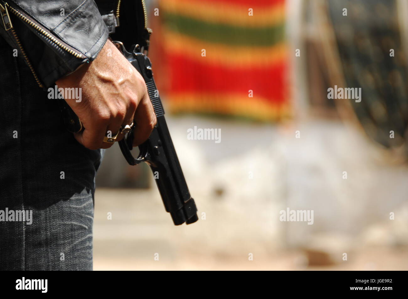Male hand with revolver Stock Photo - Alamy