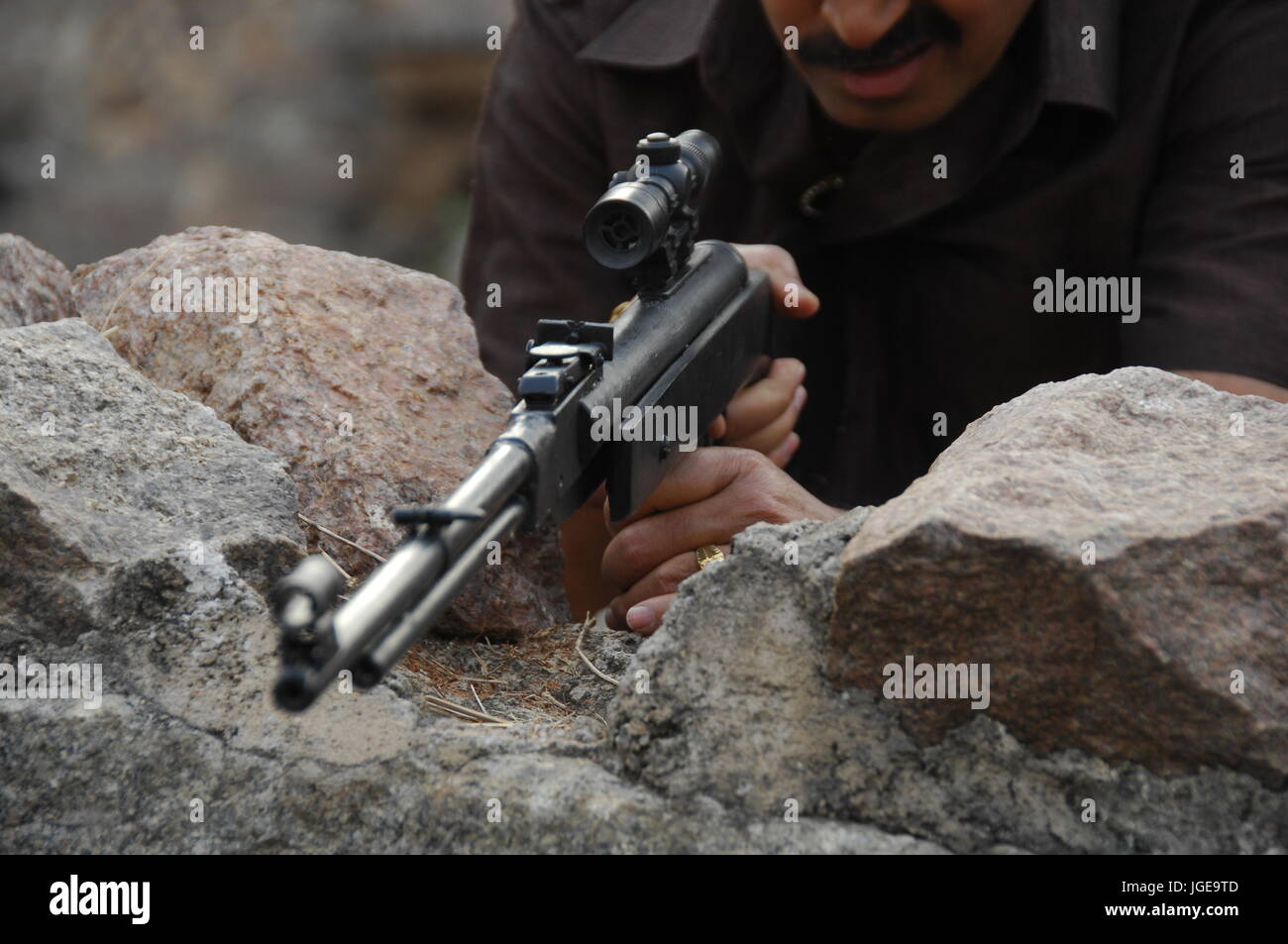 Male hand with revolver Stock Photo - Alamy