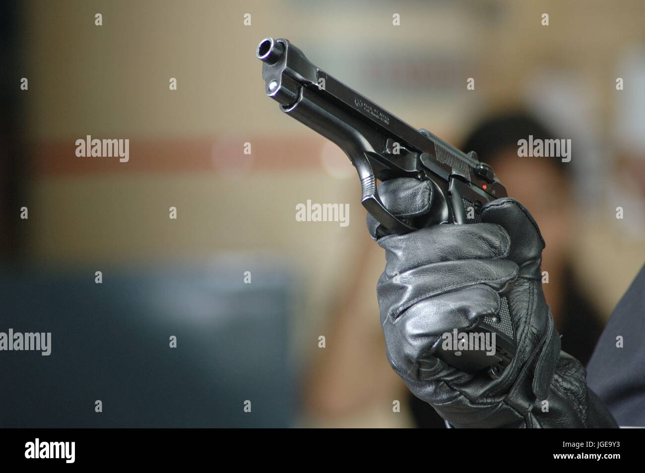 Male hand with revolver Stock Photo - Alamy