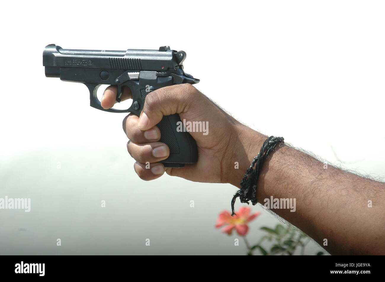 Male Hand with Gun Stock Photo - Alamy