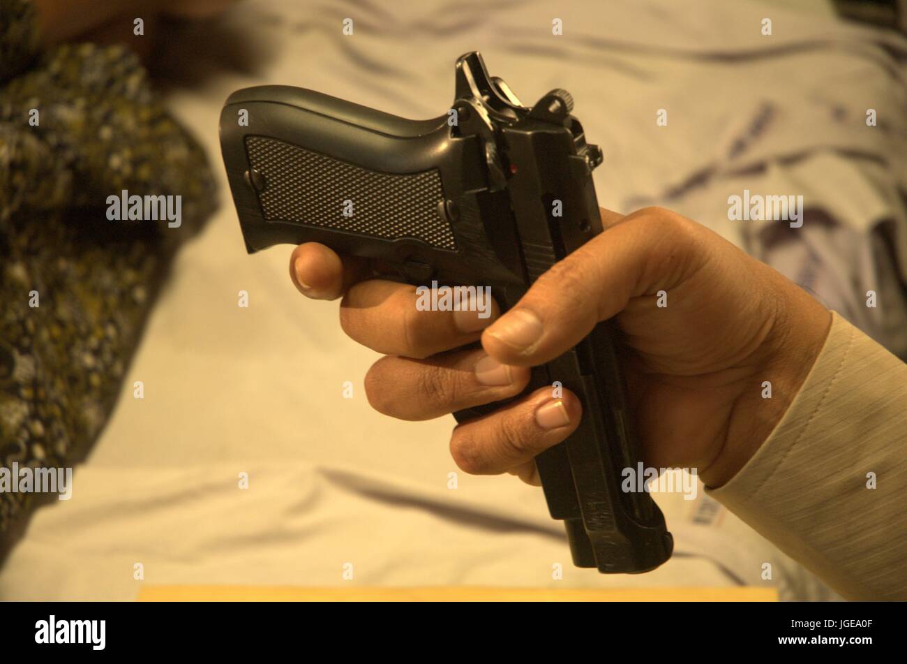 Male Hand with Gun Stock Photo - Alamy