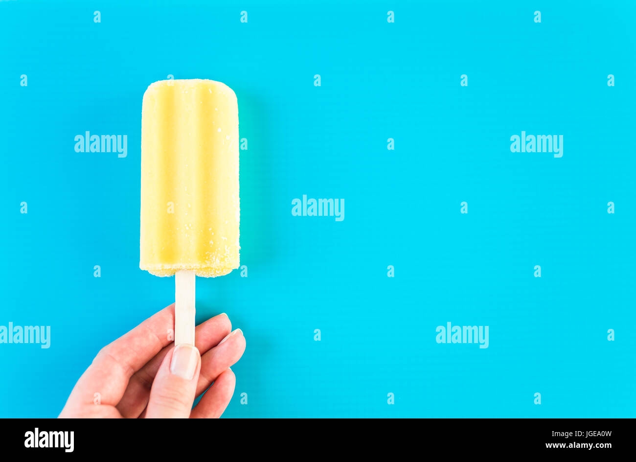 Multicolored fruit ice cream bars on colored background Stock Photo - Alamy