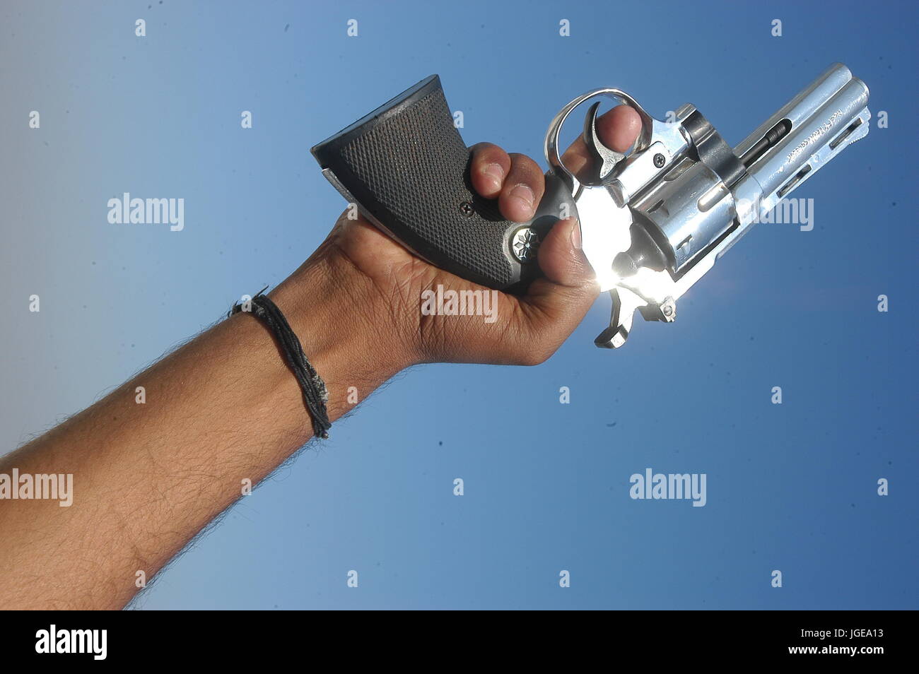 Male Hand with Gun Stock Photo - Alamy