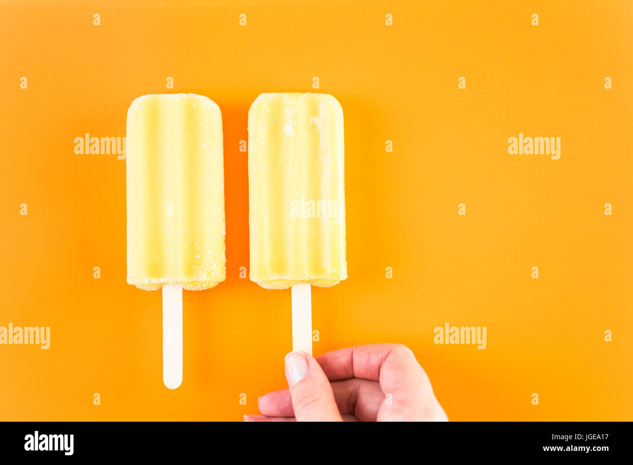 Multicolored fruit ice cream bars on colored background Stock Photo - Alamy