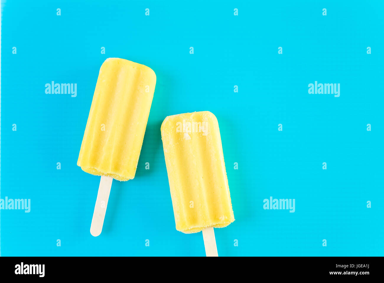 Multicolored fruit ice cream bars on colored background Stock Photo - Alamy