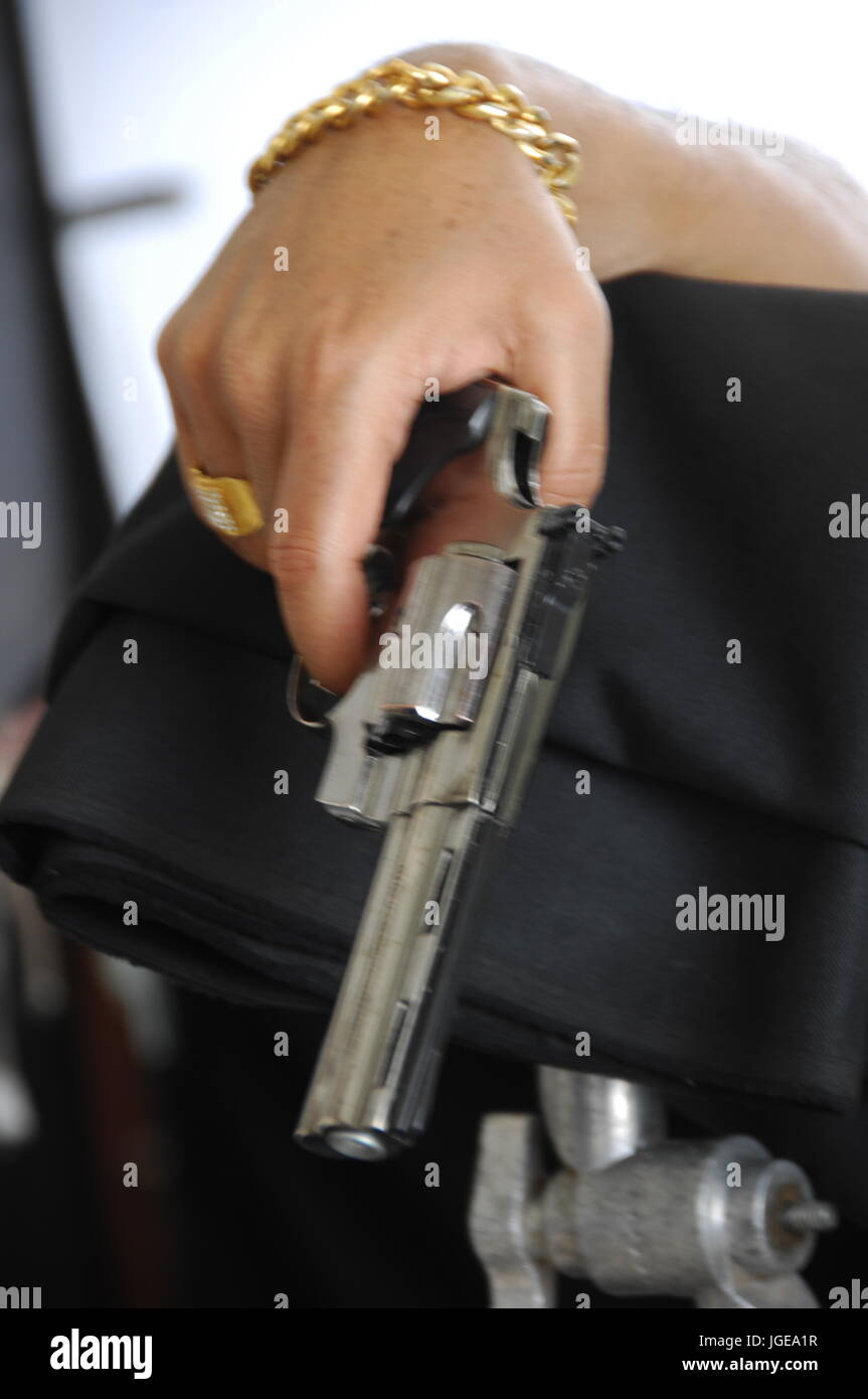 Male Hand with Gun Stock Photo - Alamy