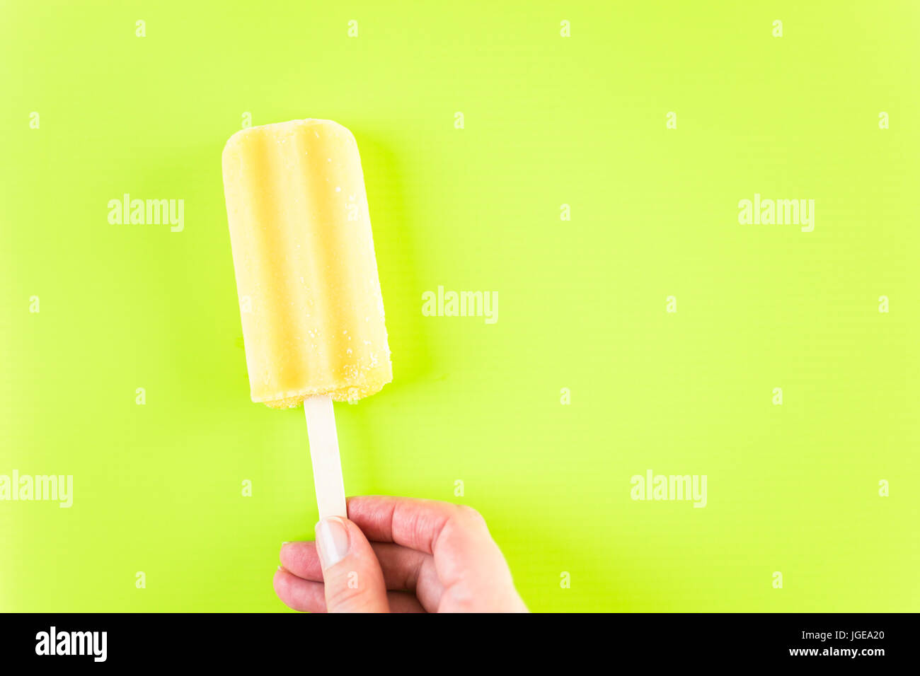 Multicolored fruit ice cream bars on colored background Stock Photo - Alamy