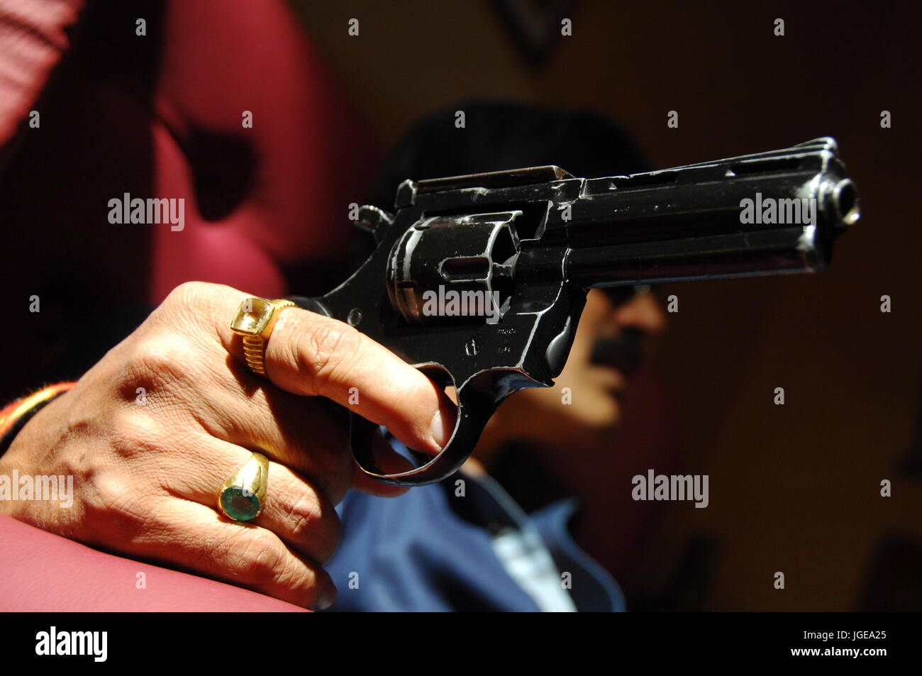 Male Hand with Gun Stock Photo - Alamy