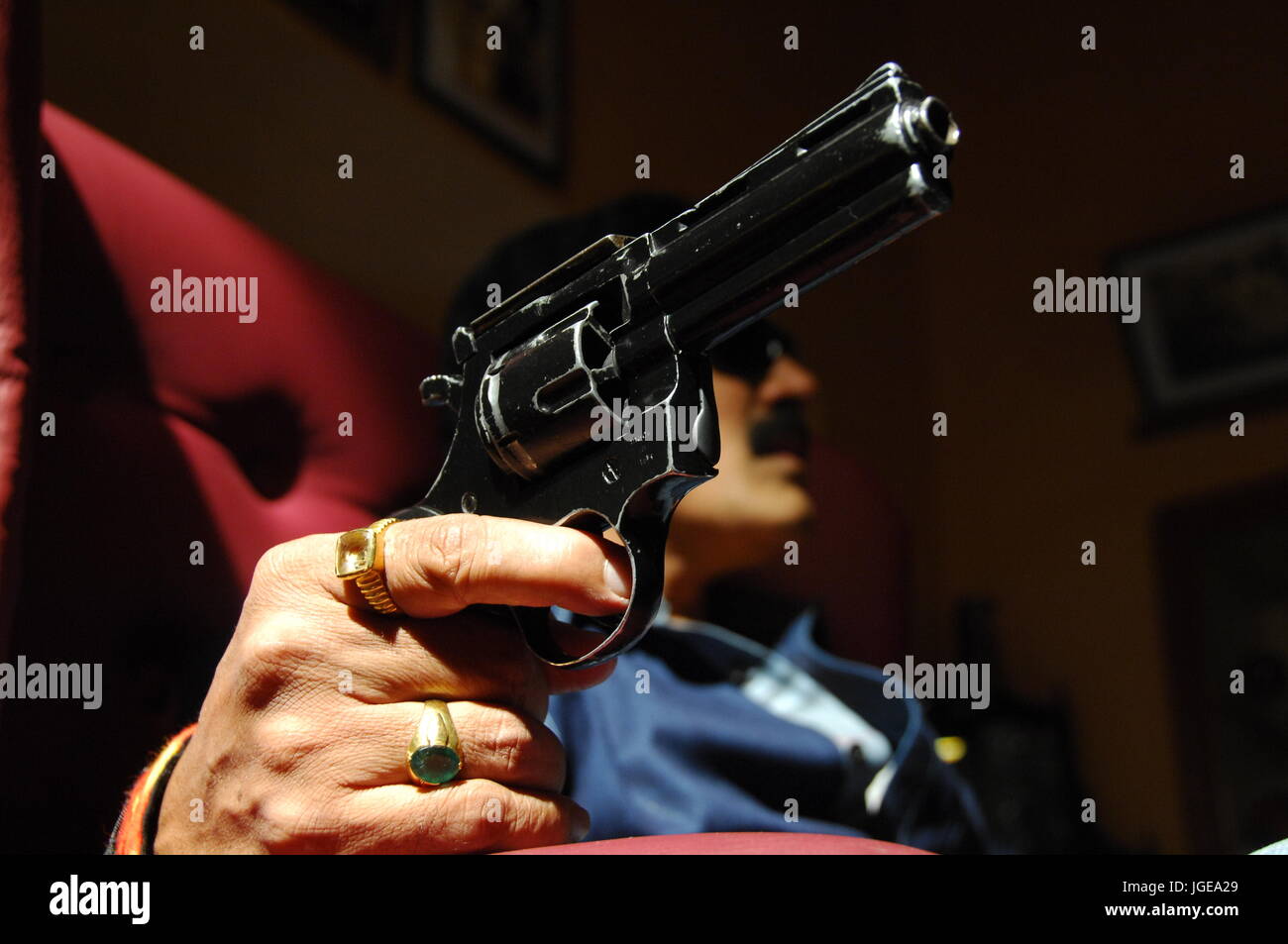 Male Hand with Gun Stock Photo - Alamy