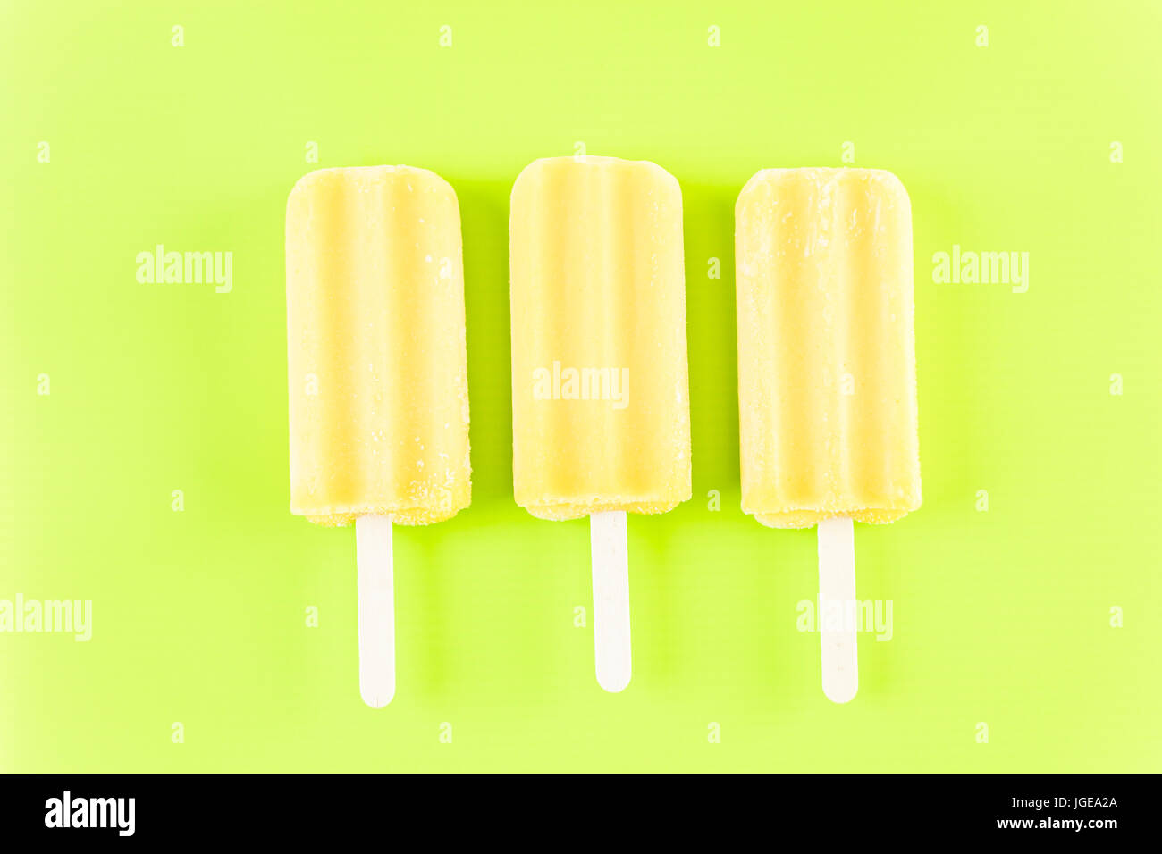 Multicolored fruit ice cream bars on colored background Stock Photo - Alamy