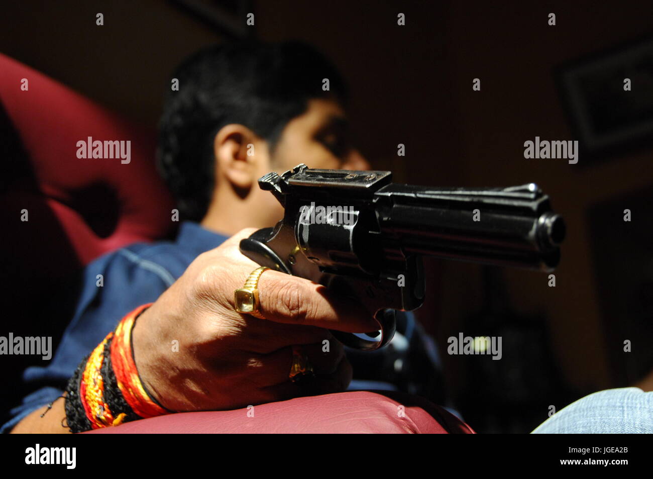 Male Hand with Gun Stock Photo - Alamy