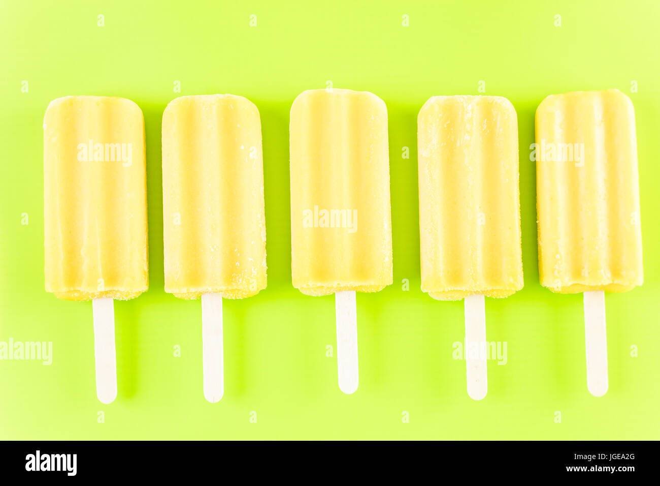 Multicolored fruit ice cream bars on colored background Stock Photo - Alamy