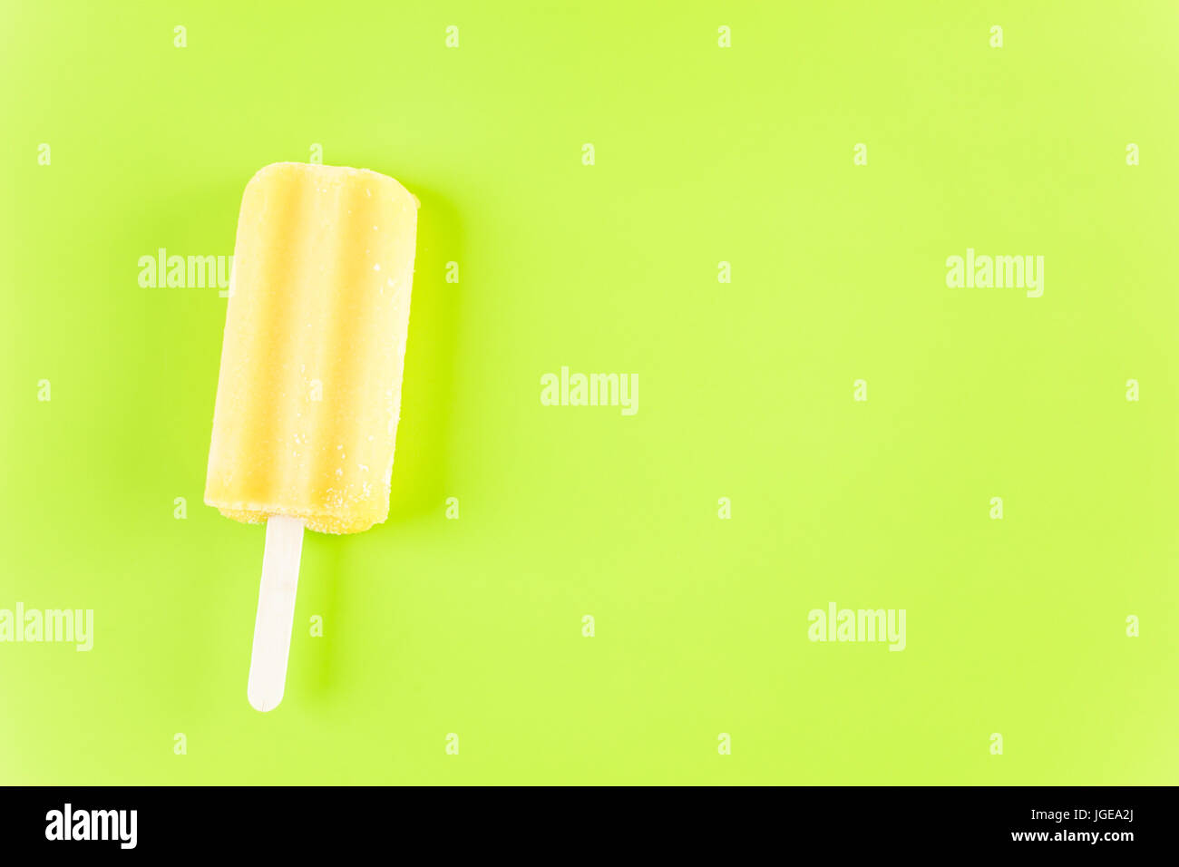 Multicolored fruit ice cream bars on colored background Stock Photo - Alamy