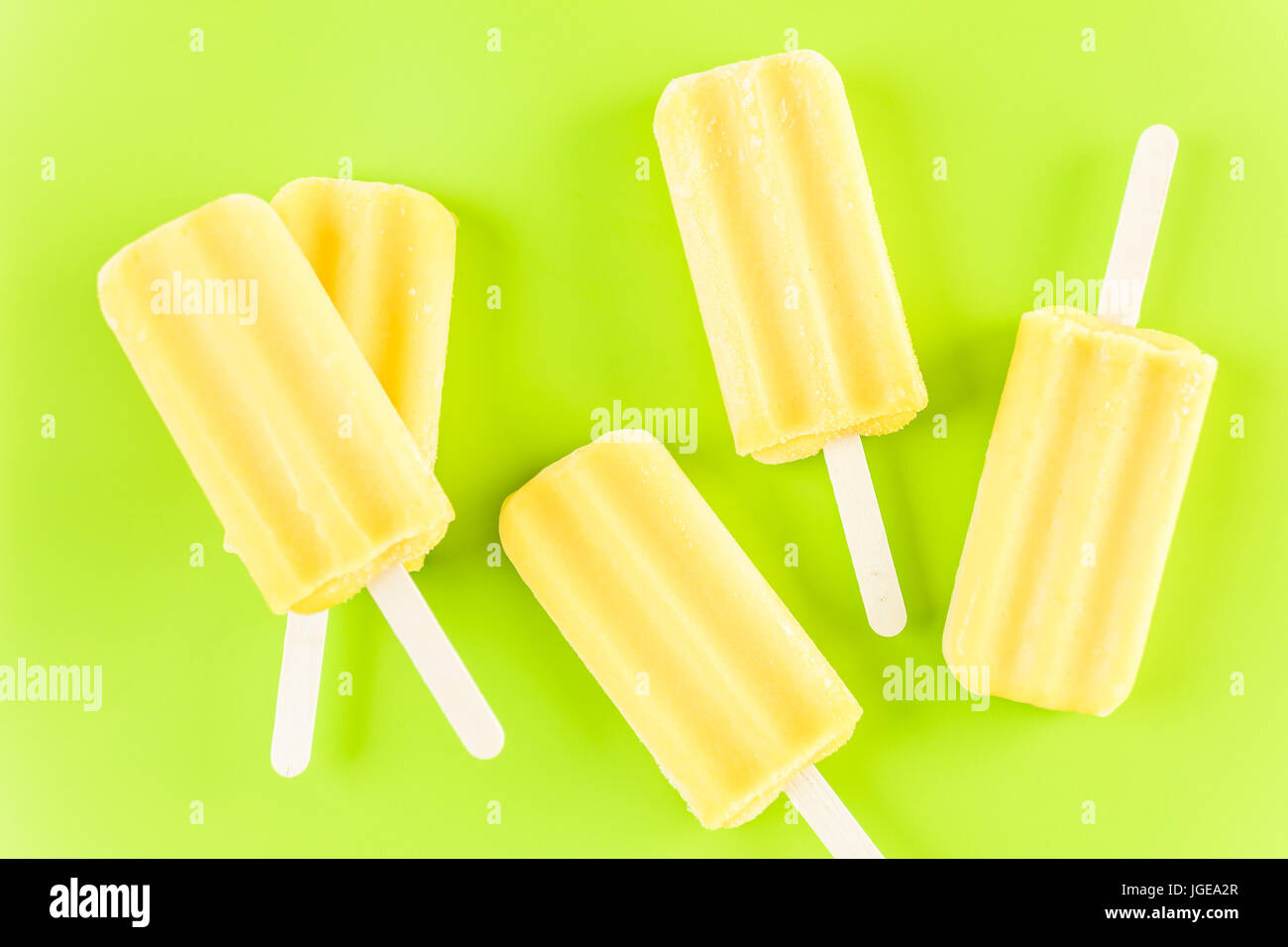 Multicolored fruit ice cream bars on colored background Stock Photo - Alamy