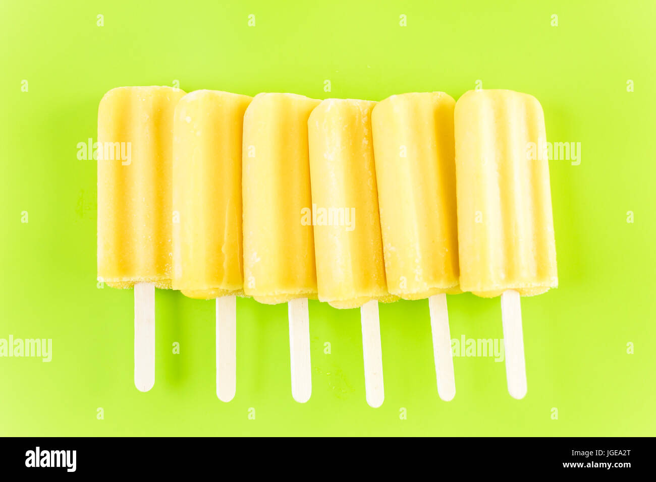 Multicolored fruit ice cream bars on colored background Stock Photo - Alamy