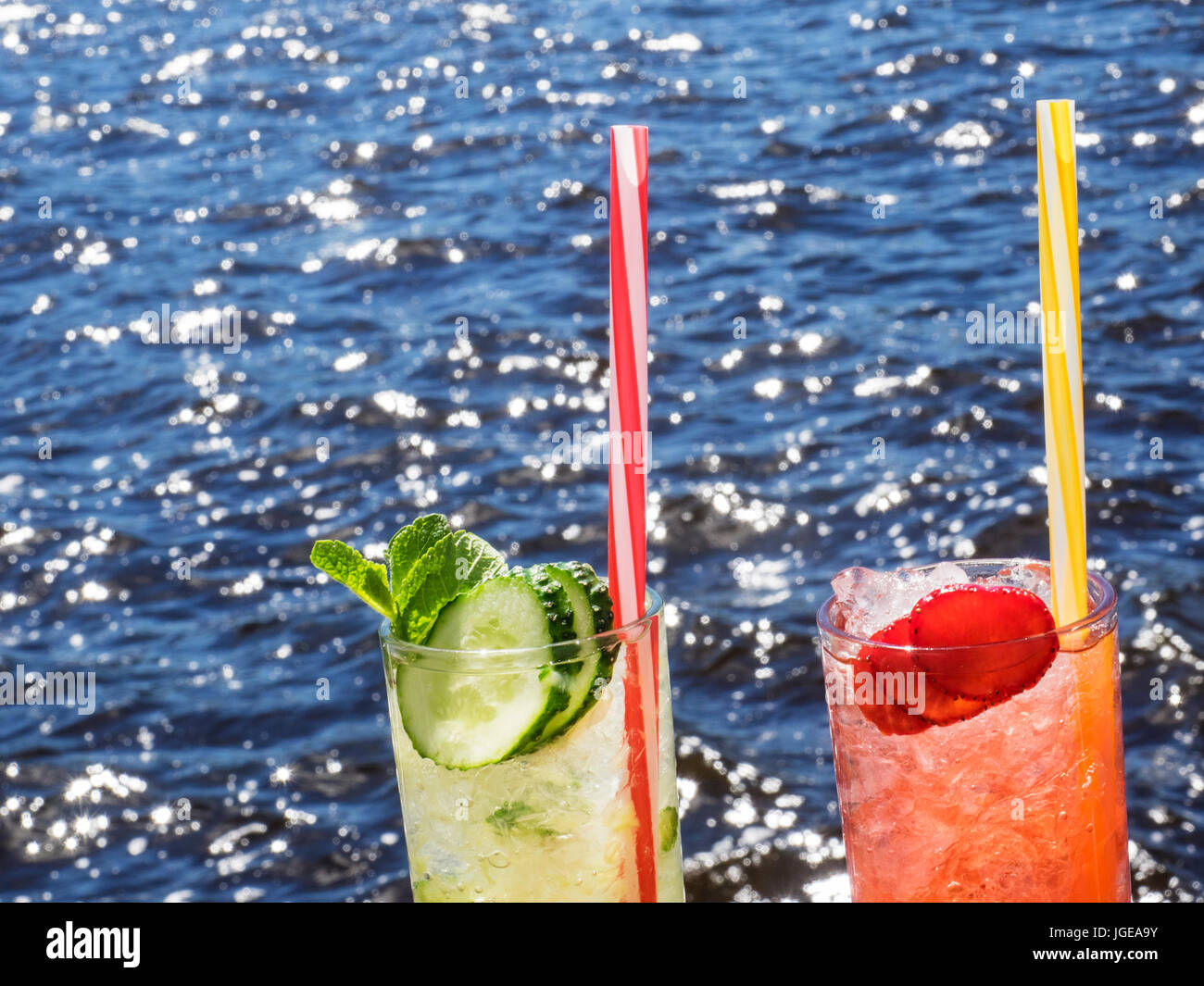 fresh summer lemonade over nature blue water Stock Photo - Alamy