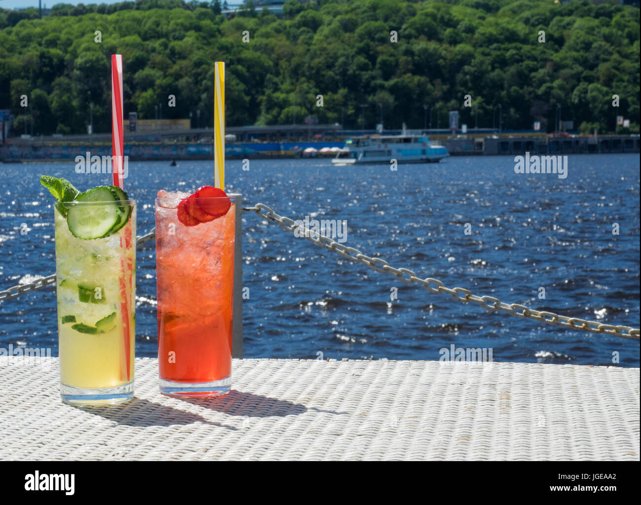 fresh summer lemonade over nature blue water Stock Photo - Alamy