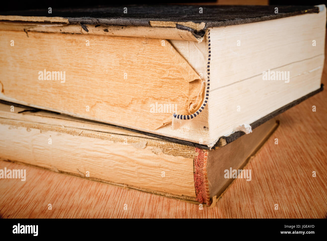 Stack of old books with damaged binding Stock Photo - Alamy