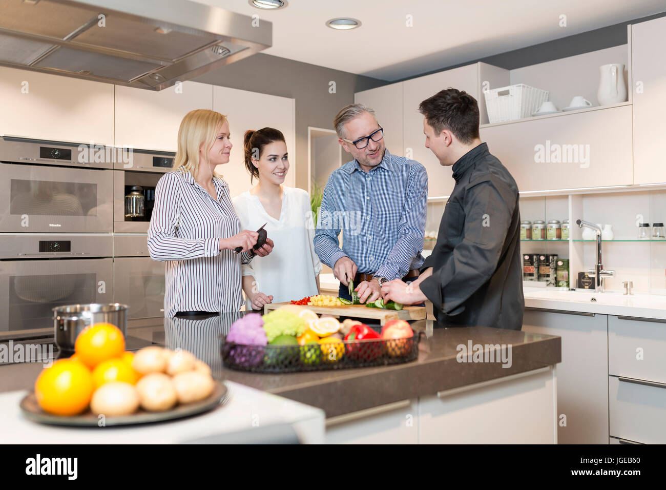 Cook gives a cooking course Stock Photo - Alamy